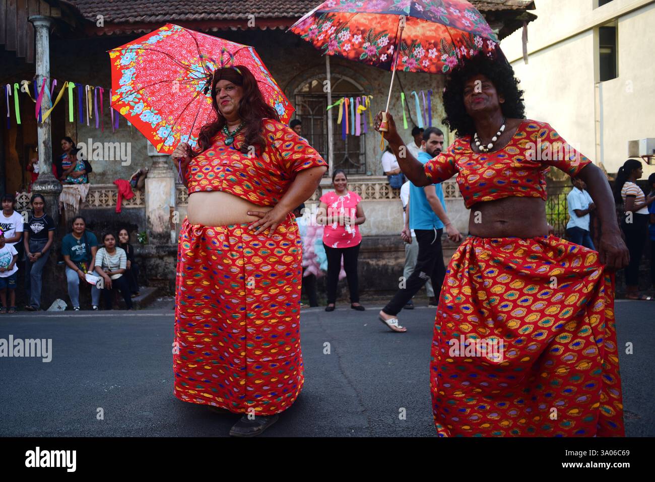 Men dressed as women dance on the beat in Goan traditional attire in ...