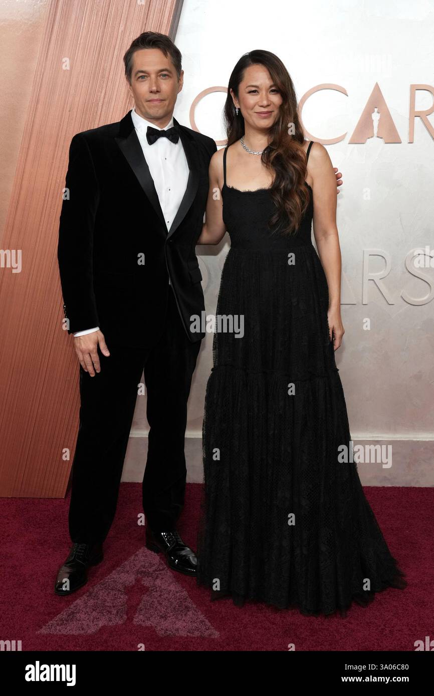 Sean Baker, left, and Samantha Quan arrive at the Oscars on Sunday ...