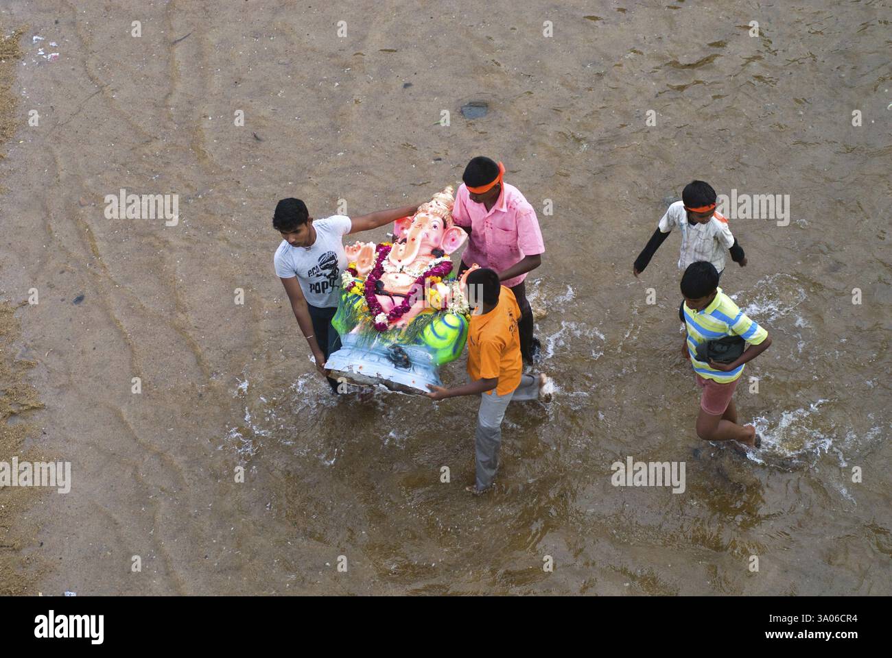 People carrying idol of lord ganesh for immersion in river bhavani on ...