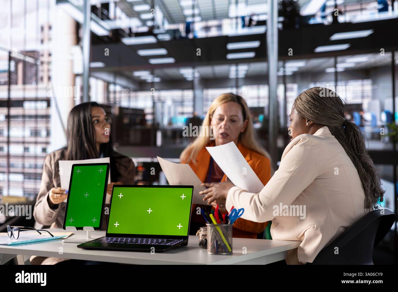 Group of diverse colleagues sharing ideas to achieve greatness in a men ...