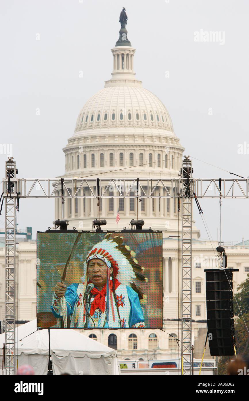 A video display on the National Mall shows a Native American elder on ...