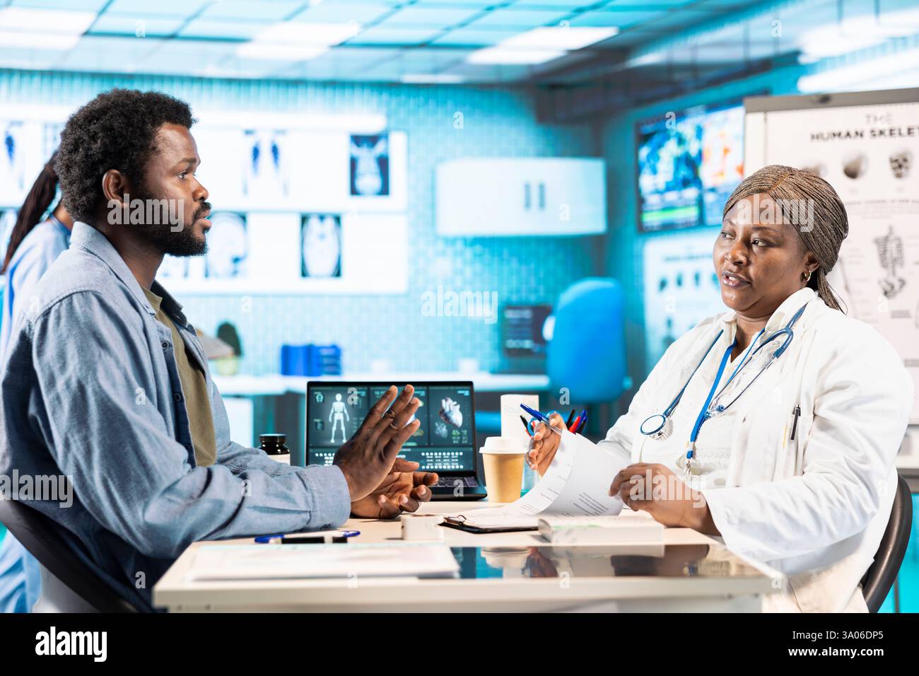 Black male patient bringing x ray test results to medic for scan ...