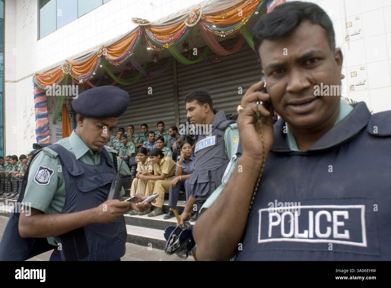 Bangladeshi Police Men Dialing Numbers of Mobiles holding in Hand on ...