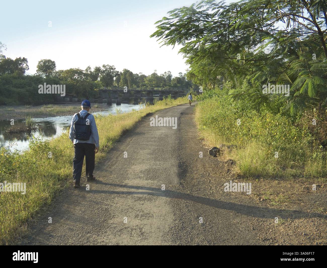 Hicker walking by the river side, Kondivade village, Karjat, Mumbai ...