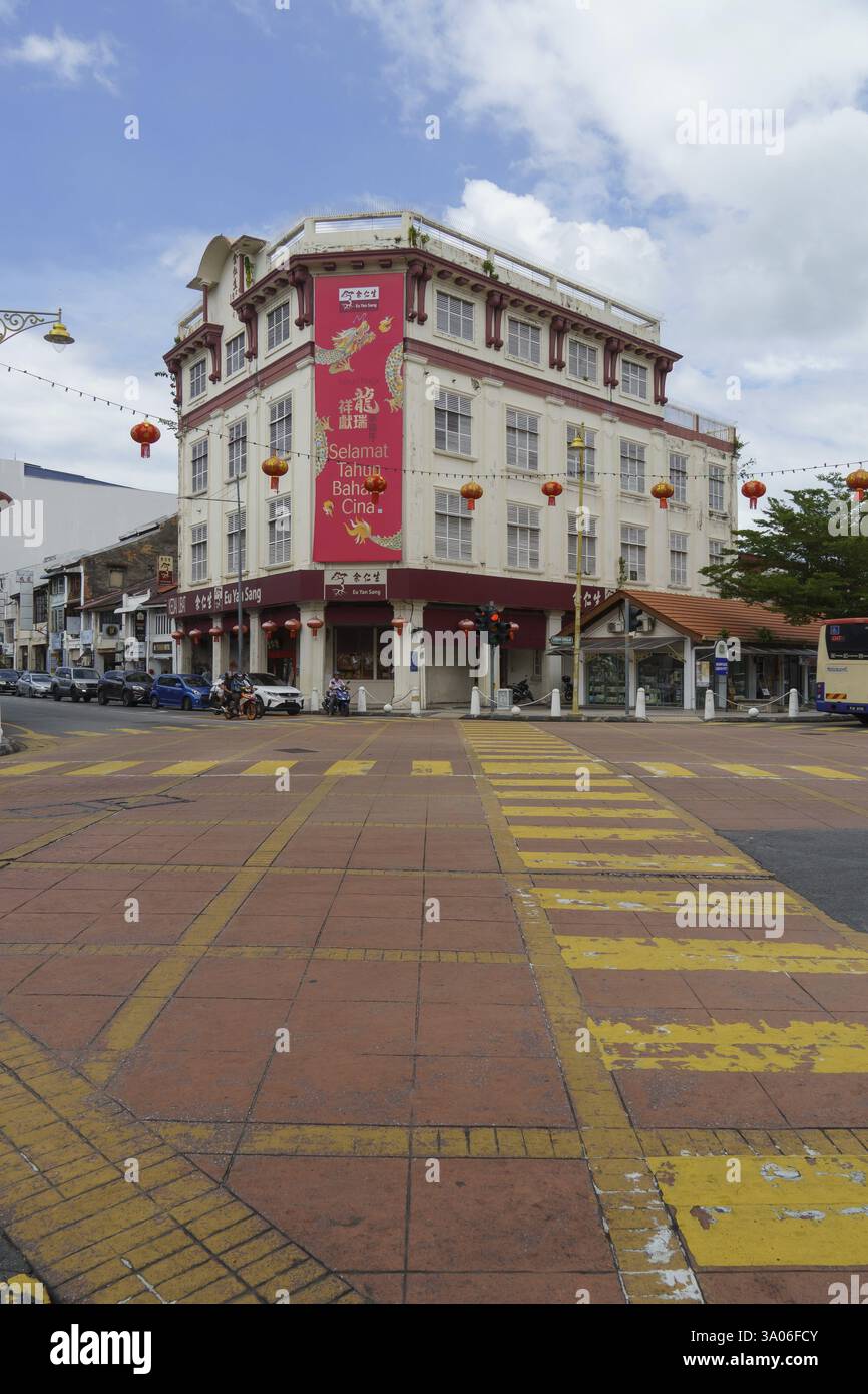 Large building at a busy intersection with festive lanterns and ...