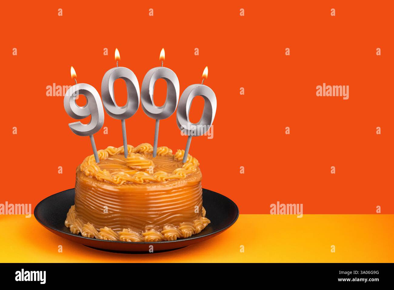 Number of followers or likes - Candle number 9000 Stock Photo - Alamy
