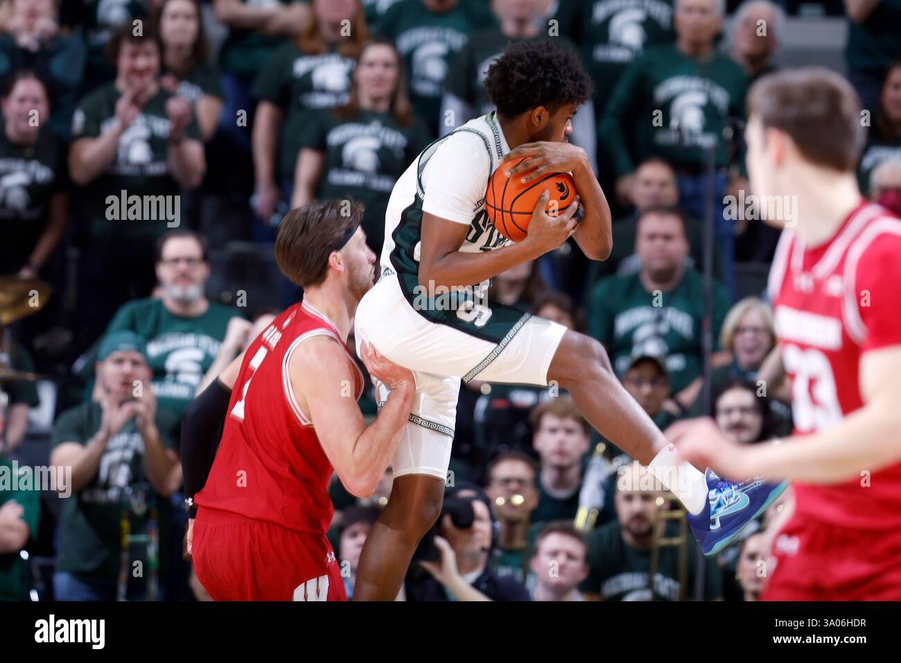 Michigan State guard Jase Richardson, top, pulls down a rebound against ...