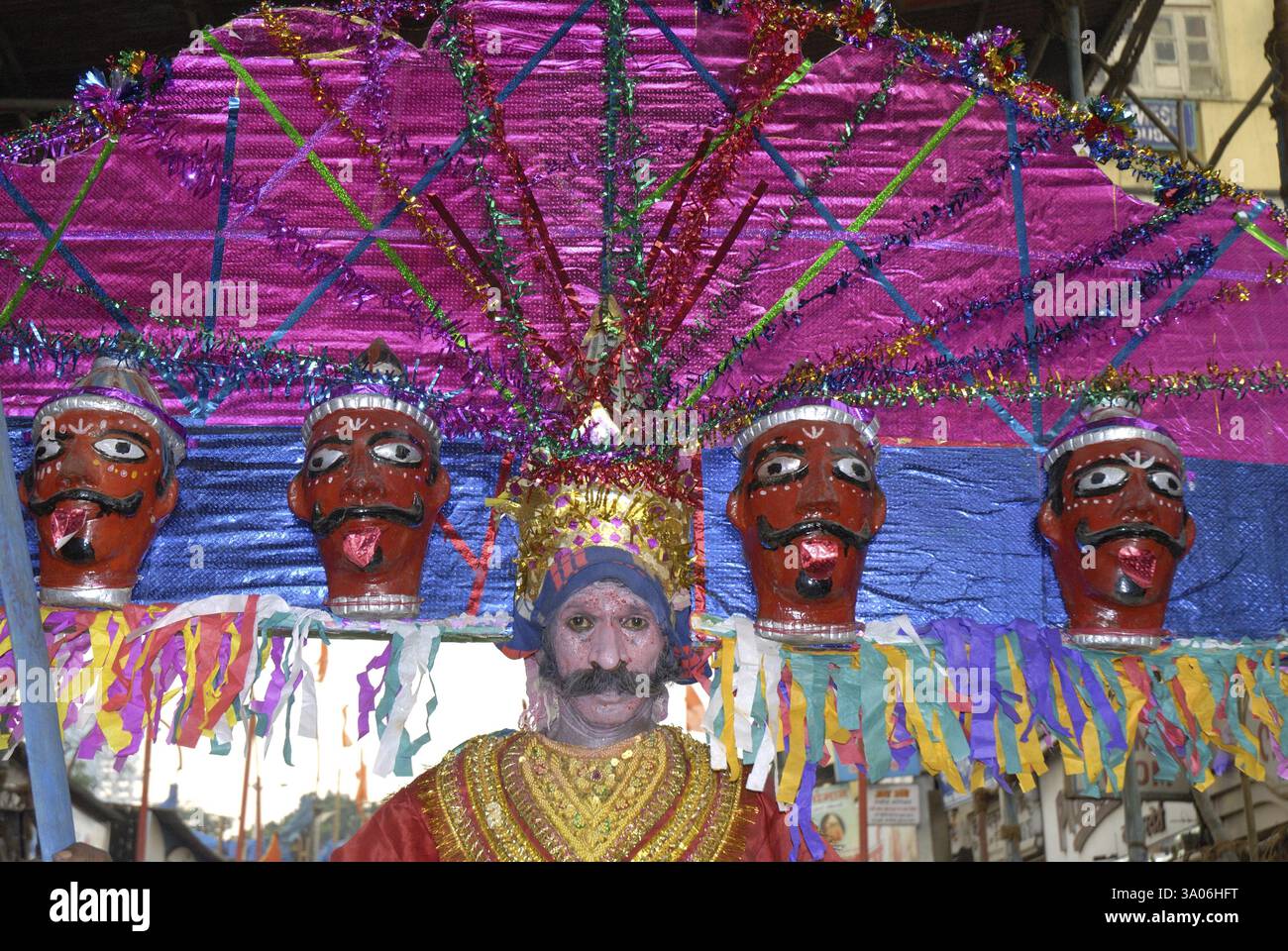 Man wearing ten face ravana costume dancing in Navaratri festival ...