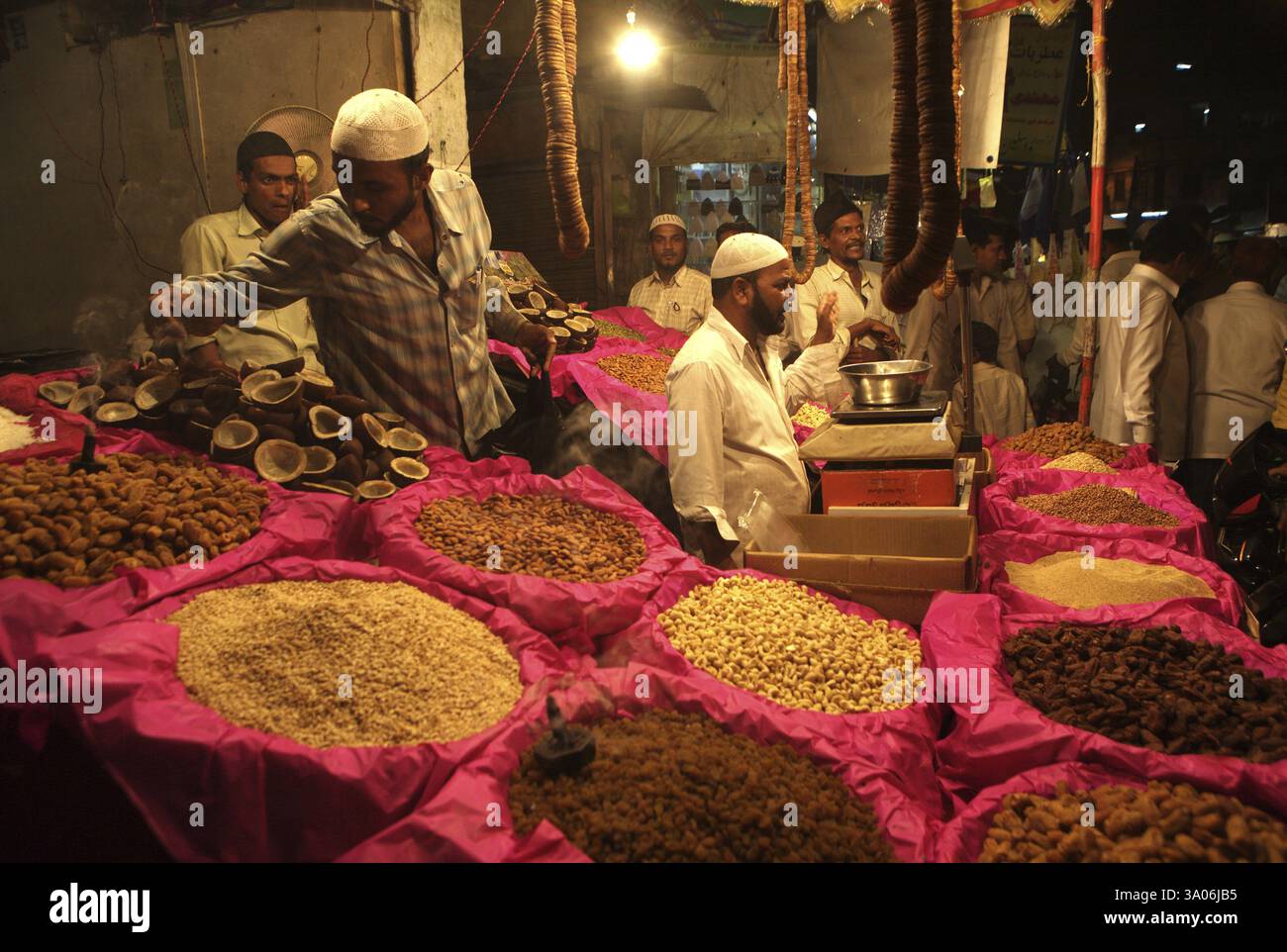 A dry fruit merchant shop at the local market of Malegaon, Maharashtra ...