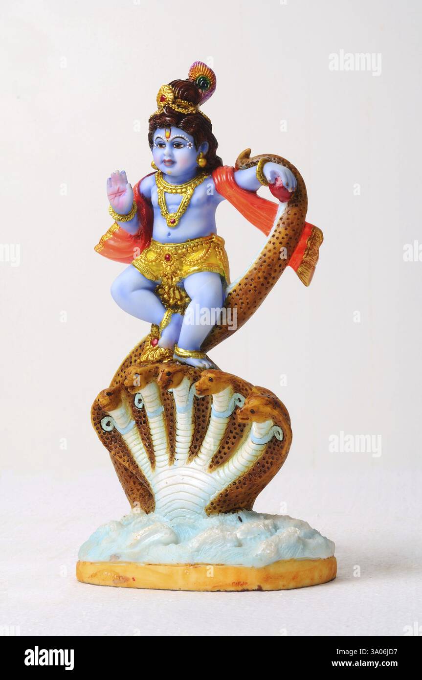 Clay statue of bal krishna on kaliya snake Stock Photo - Alamy