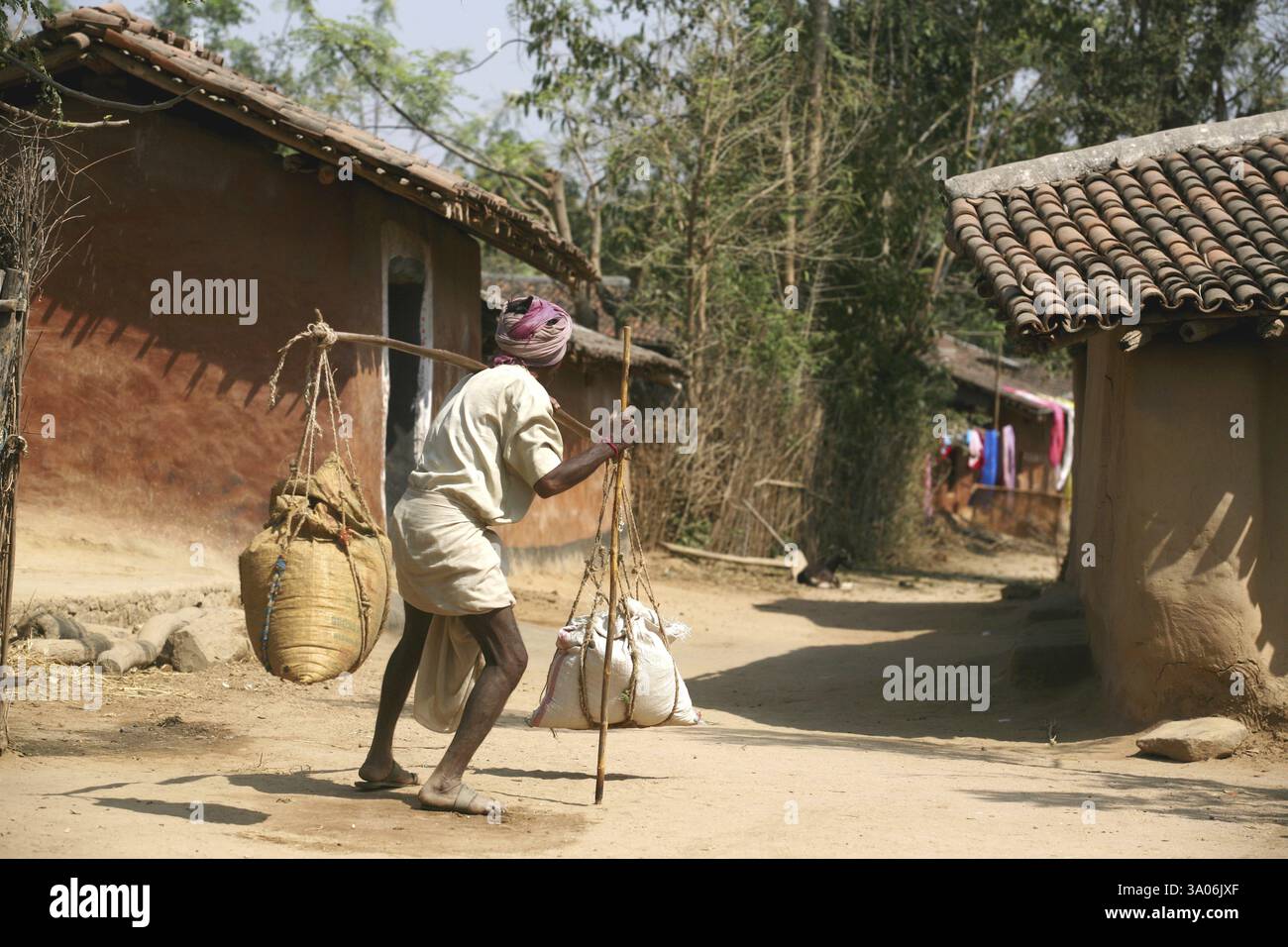 Traditional merchant sells food grain home to home in exchange of old ...