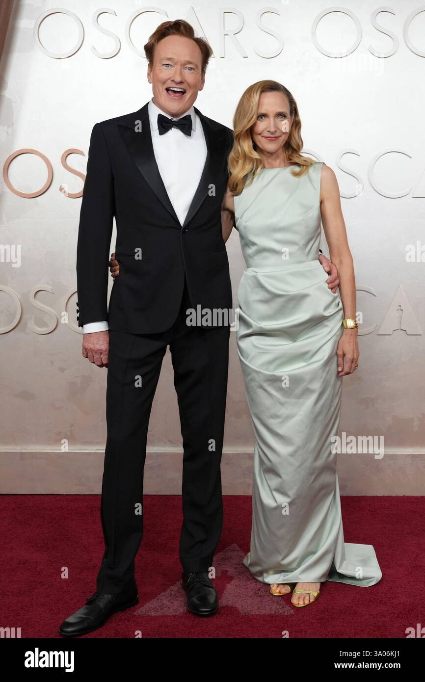 Conan O'Brien, left, and Liza Powel O'Brien arrive at the Oscars on ...