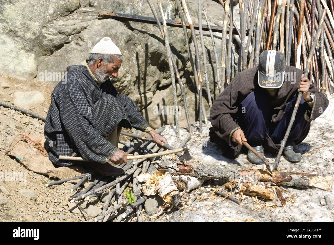 Men making sticks on hill Chandanvaadi Jammu and Kashmir India Asia ...
