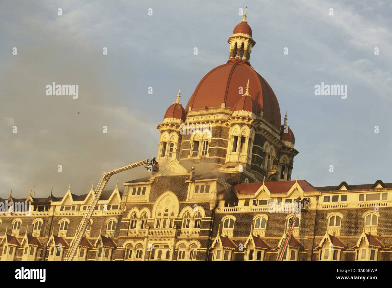 Mumbai fire brigade officers putting off fire at top of Taj Mahal hotel ...