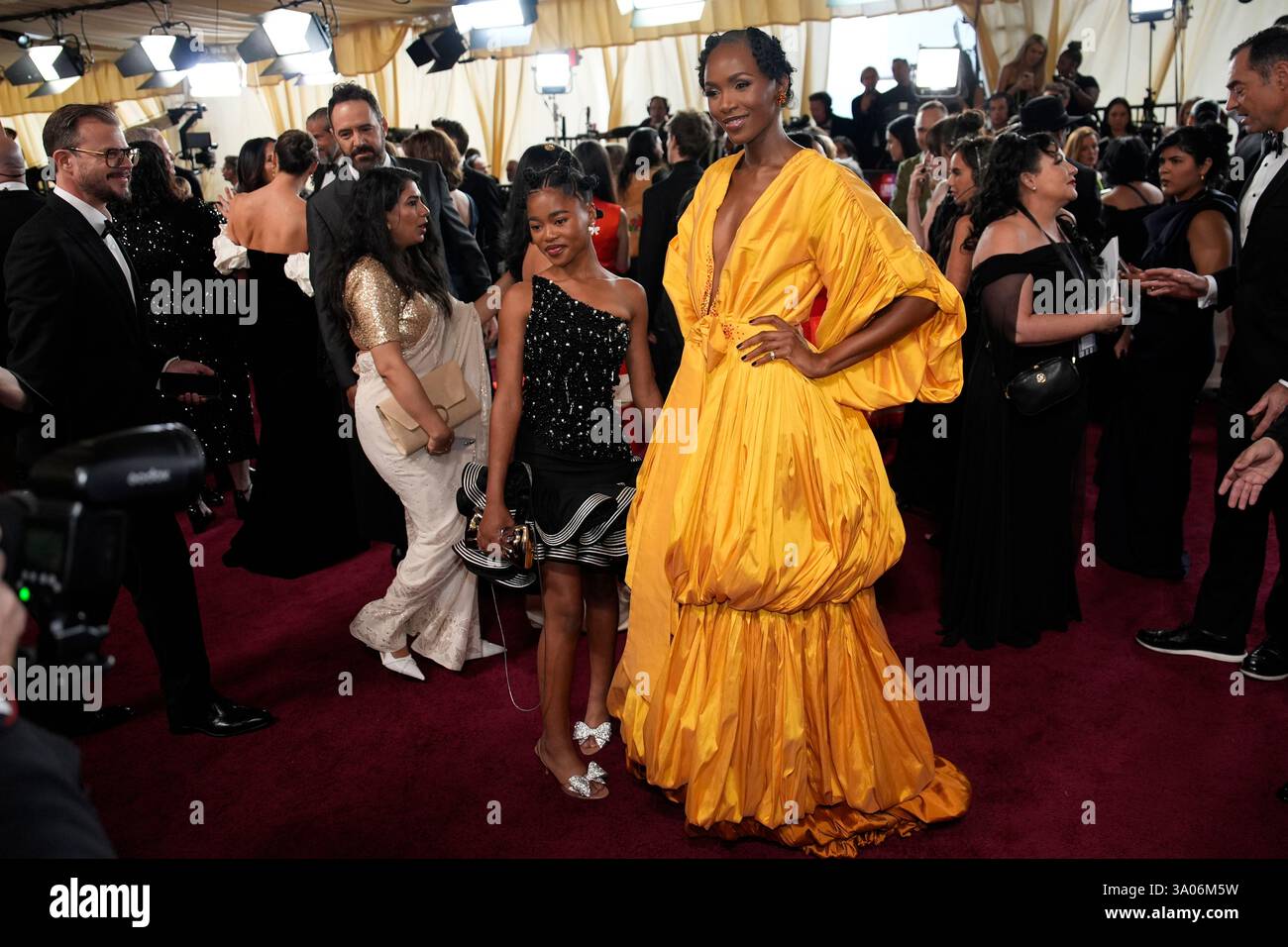 Liyabona Mroqoza, left, and Avumile Qongqo arrive at the Oscars on Sunday, March 2, 2025, at the ...