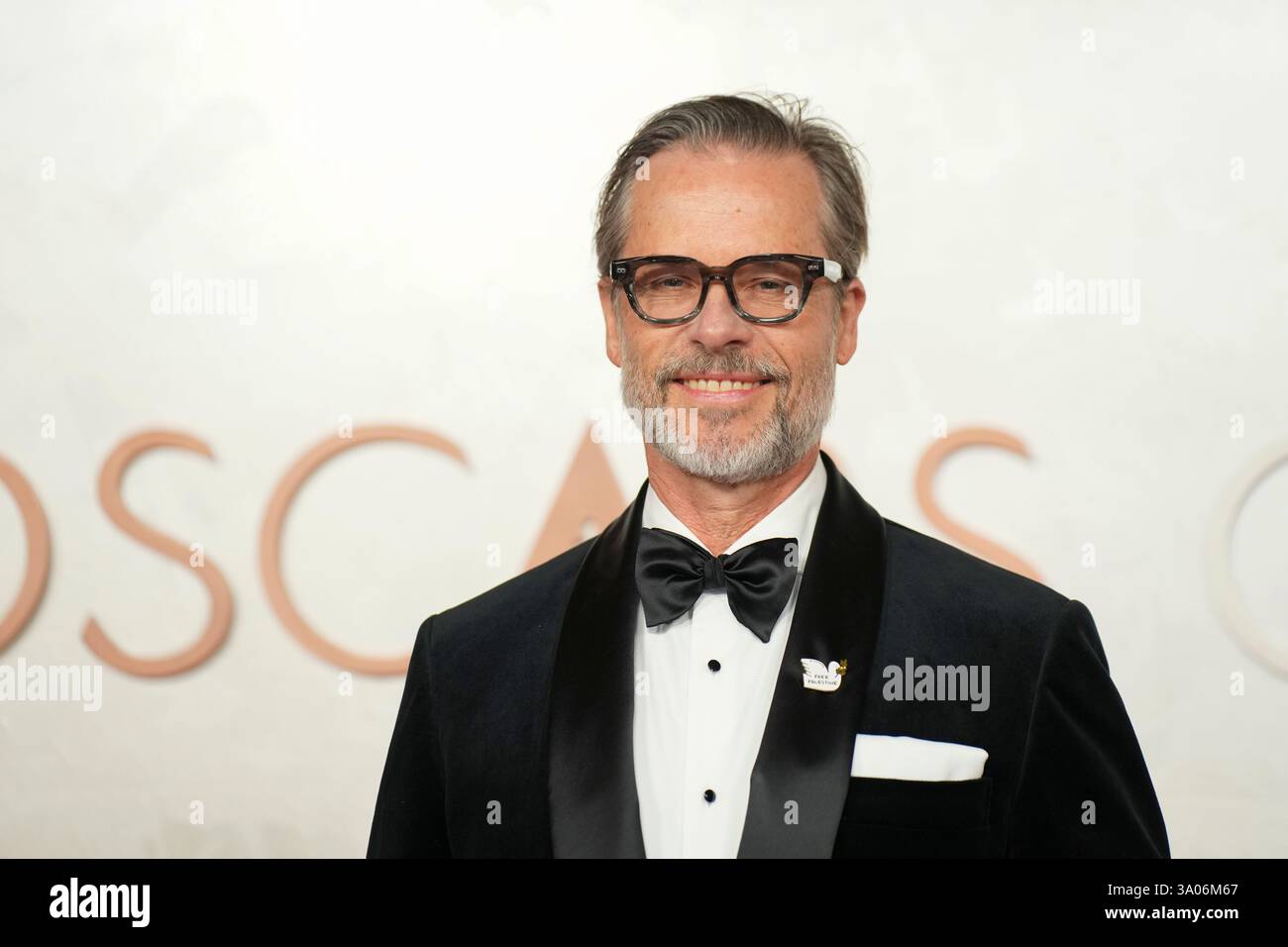 Guy Pearce arrives at the Oscars on Sunday, March 2, 2025, at the Dolby ...