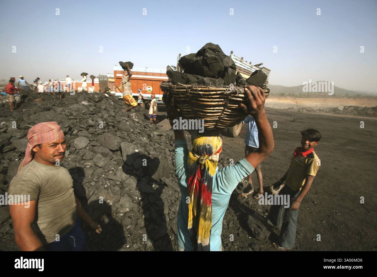 Workers loading coal from Coal mine in truck in Jharkhand, India NO MR ...