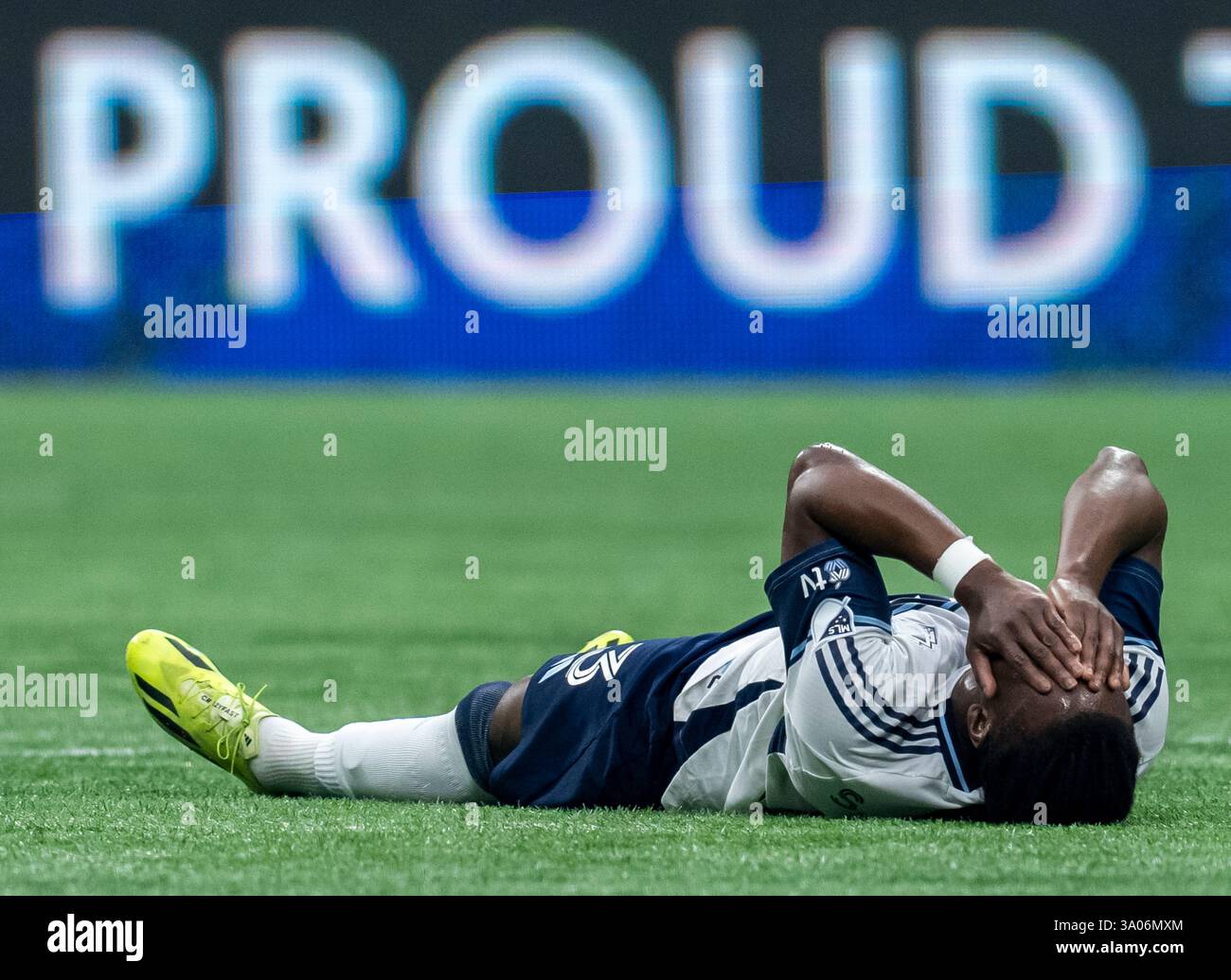 Vancouver Whitecaps' Sam Adekugbe lies on the ground during the first ...