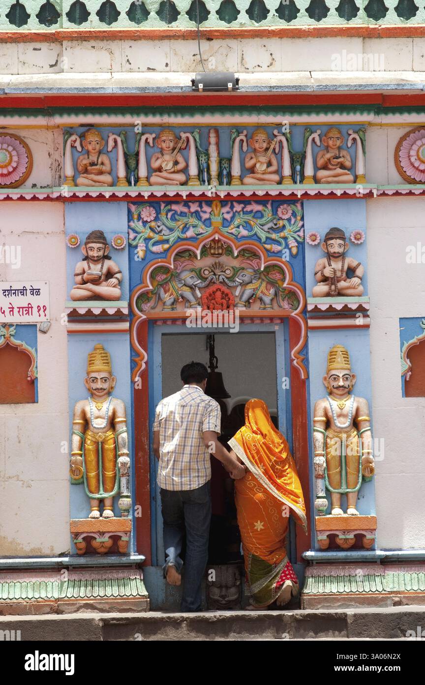 Couple at entrance of shree vighneshwar temple, Ozar, Junnar, Pune ...