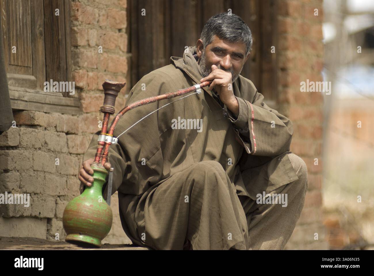 Man enjoying Hukka at Jammu and Kashmir India Asia MR#721 Stock Photo ...
