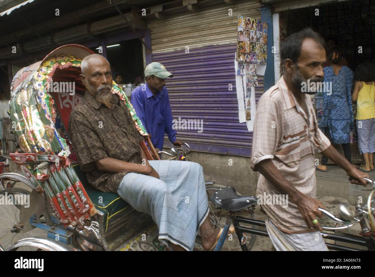 Cycle Rickshaw Rider with Passenger on street at Dhaka, Bangladesh ...