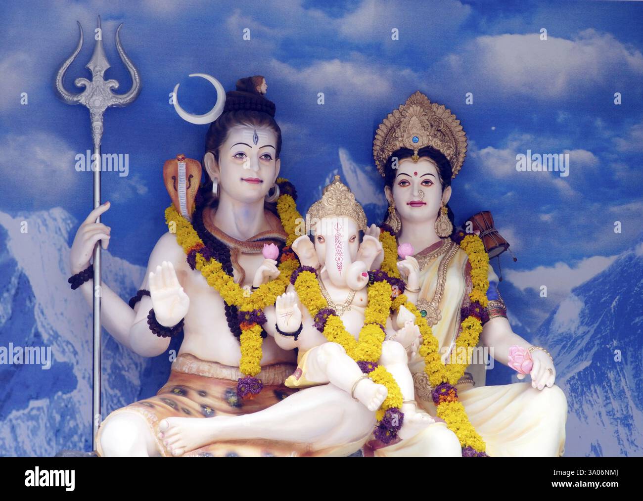 Child infant Ganesh father Lord Shiva, mother Parvati, colourful idols ...