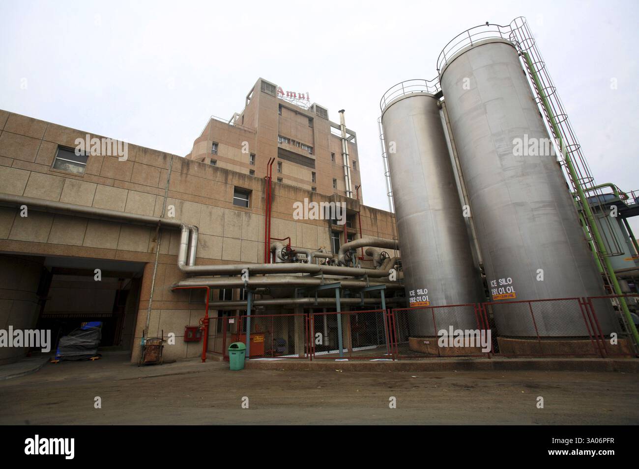 Large tanks and exterior view of Amul factory in Anand, Gujarat, India ...