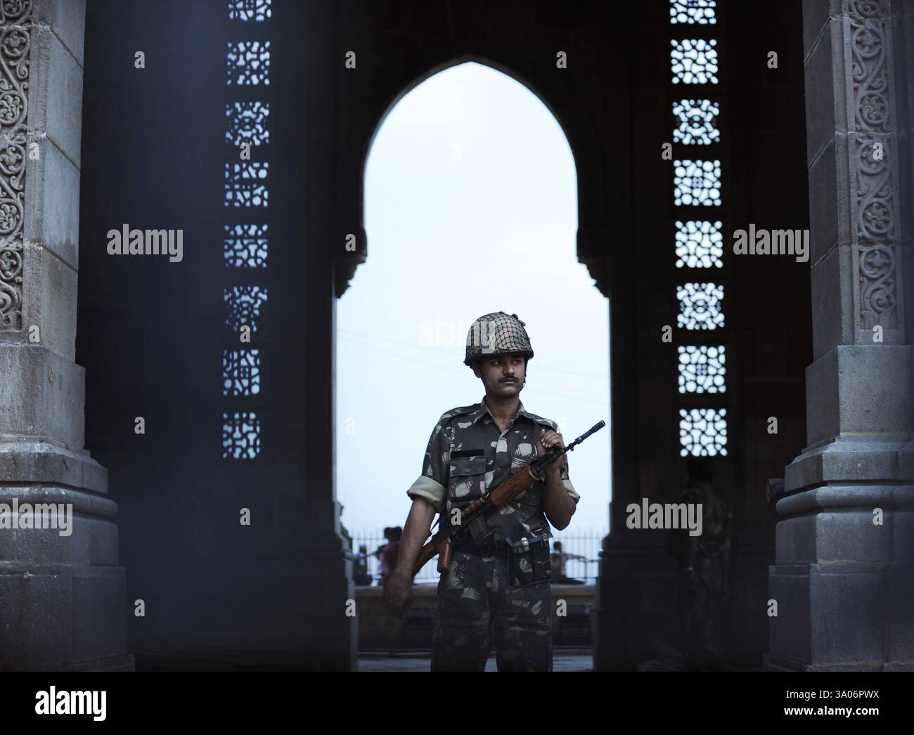 Army officer with gun Gateway India, after terrorist attack by Deccan ...