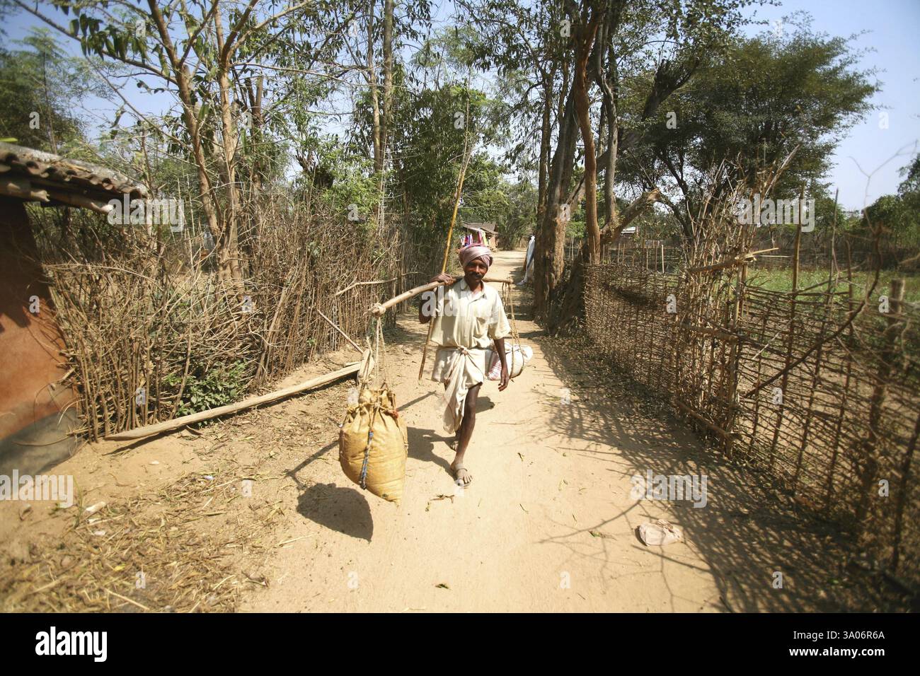 Traditional merchant sells grain home to home in exchange of old things ...