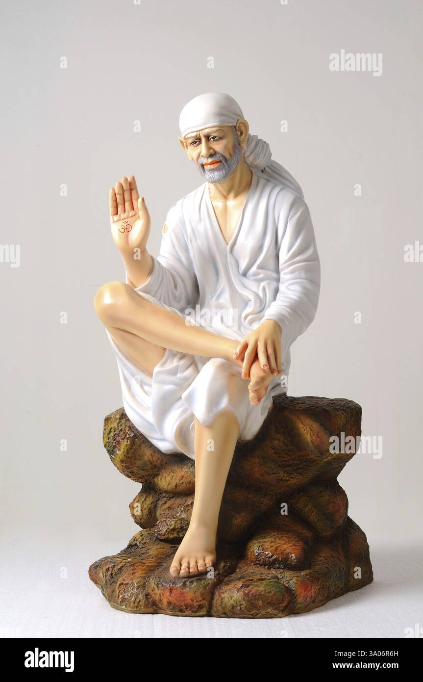 Clay statue of god sai baba Stock Photo - Alamy