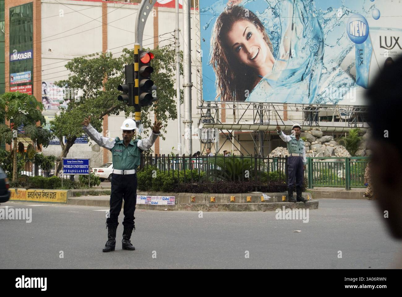 Traffic Police Controlling Traffic On Street and Aishwarya Rai Hoarding ...