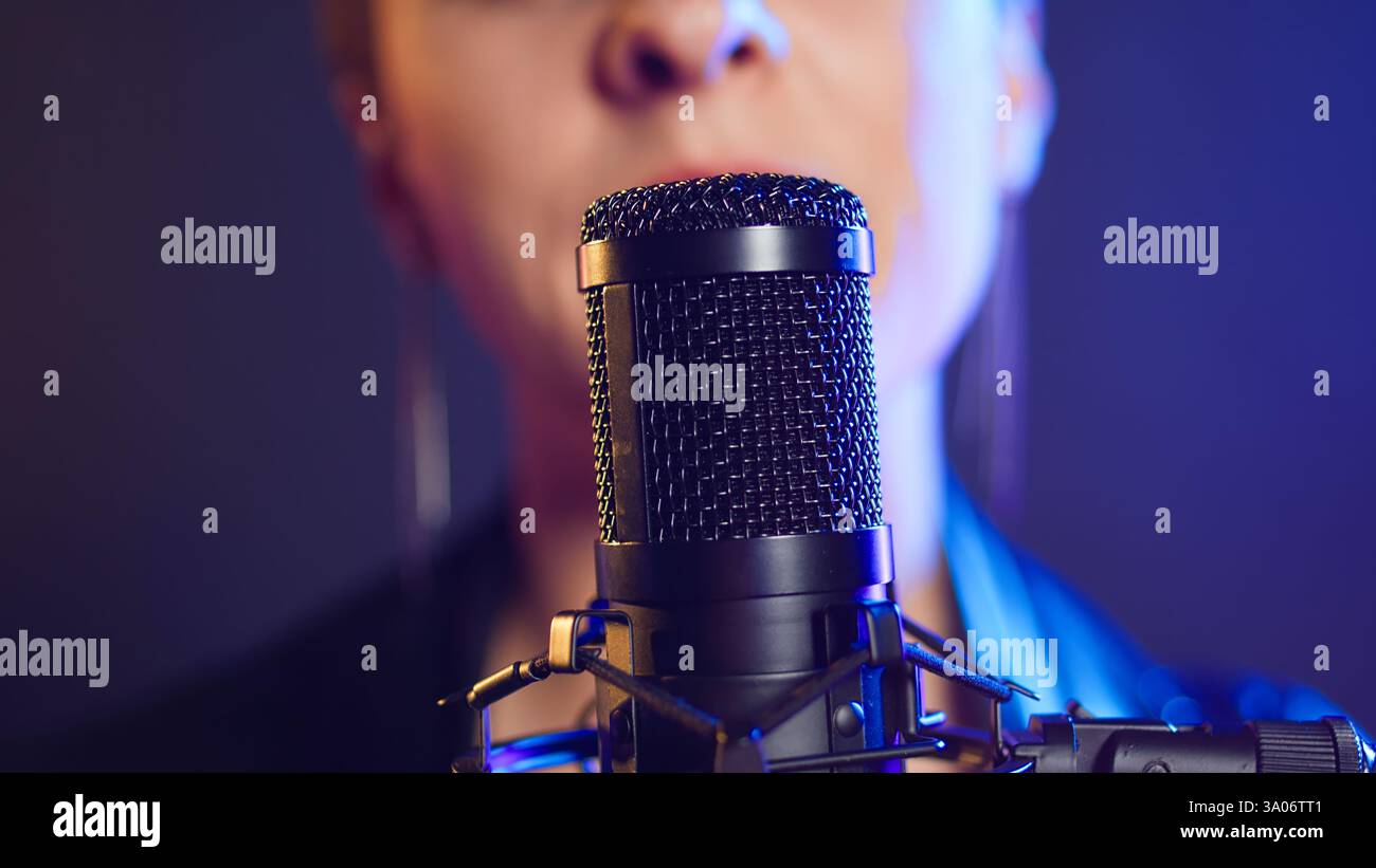 Fierce iconic rock star woman sings passionately into the microphone ...