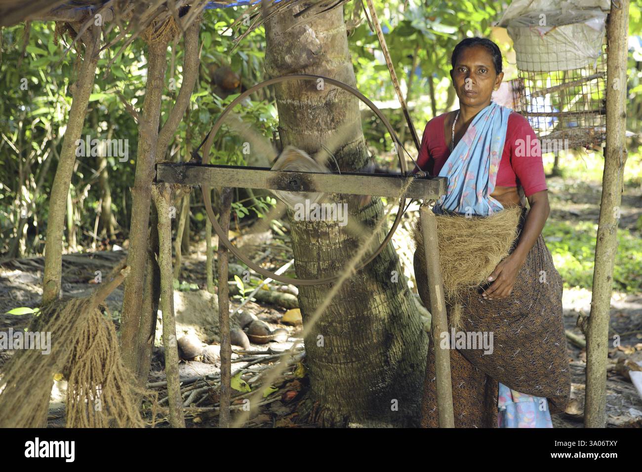 Keralite woman making coir rope in cottage, traditional method, Kerala ...
