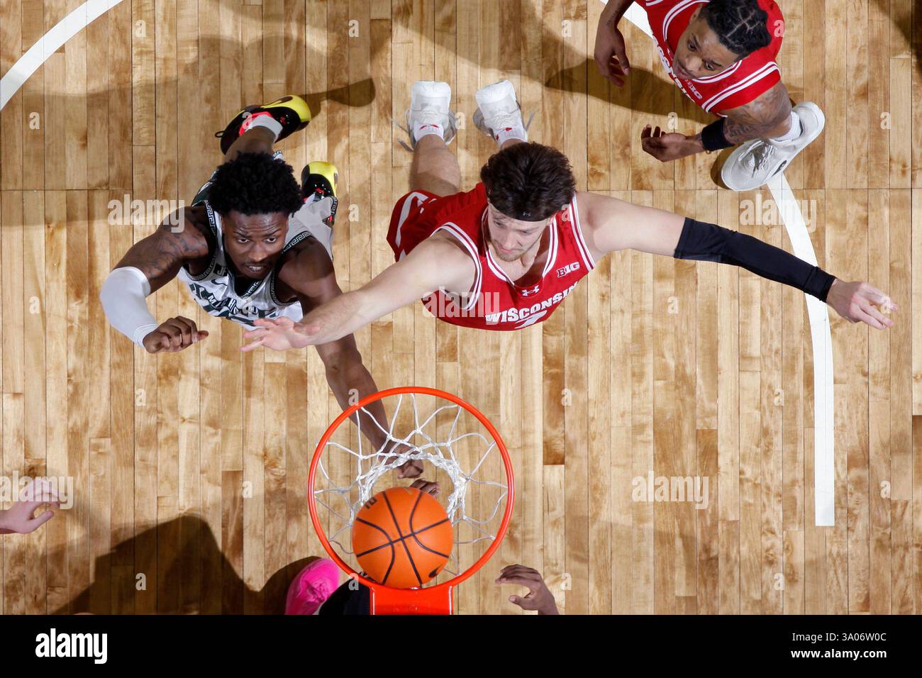 Michigan State forward Coen Carr, left, Wisconsin forward Carter ...