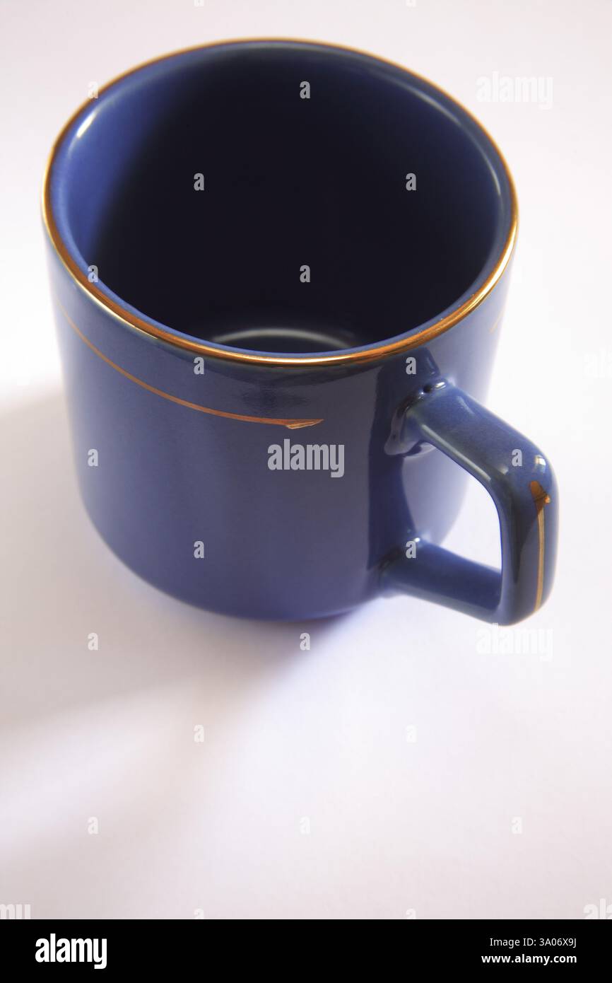 Blue coffee mug on white background Stock Photo - Alamy