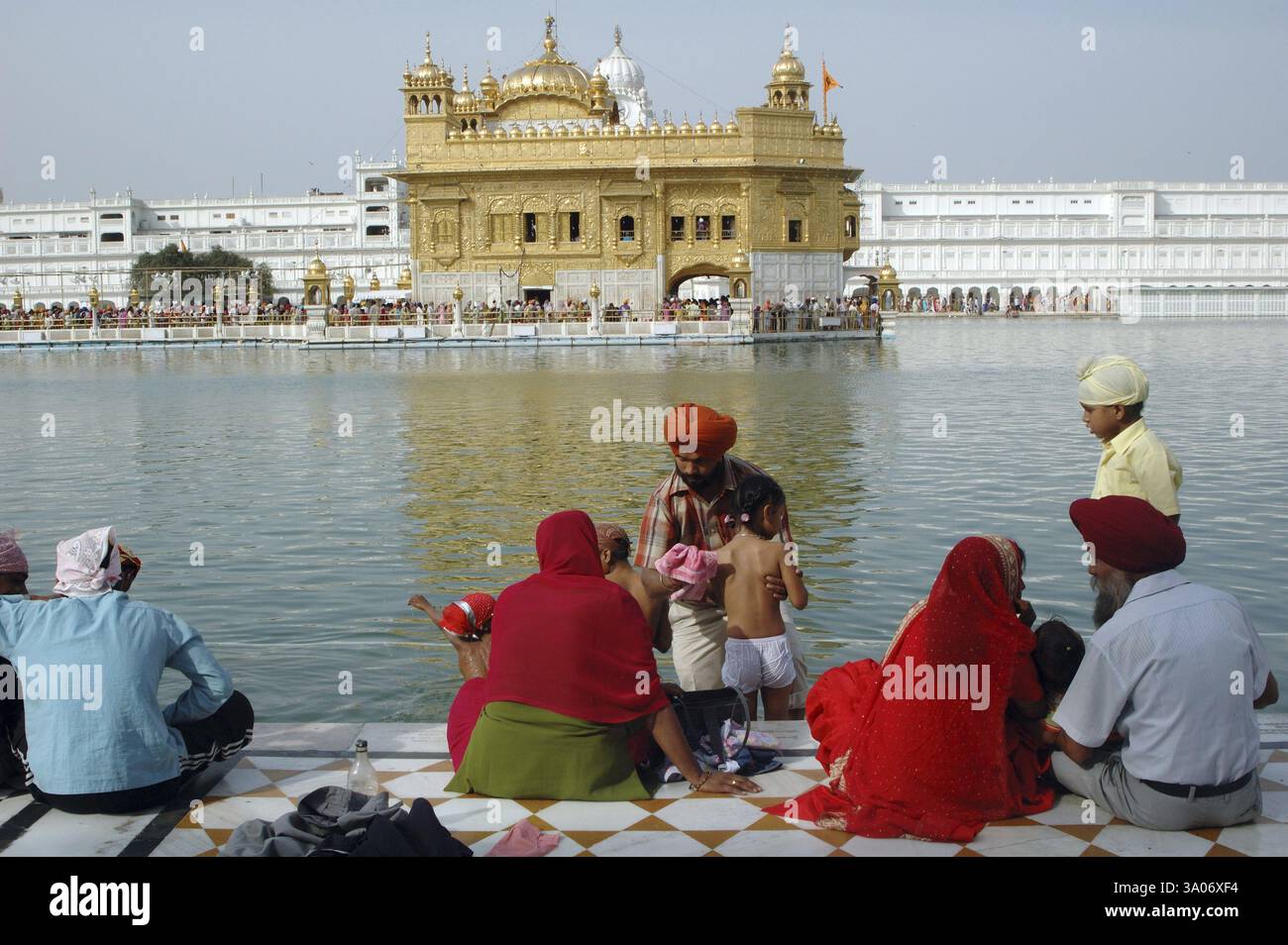 Sikh devotees take a holy dip in Amrit sarovar the lake of nectar ...