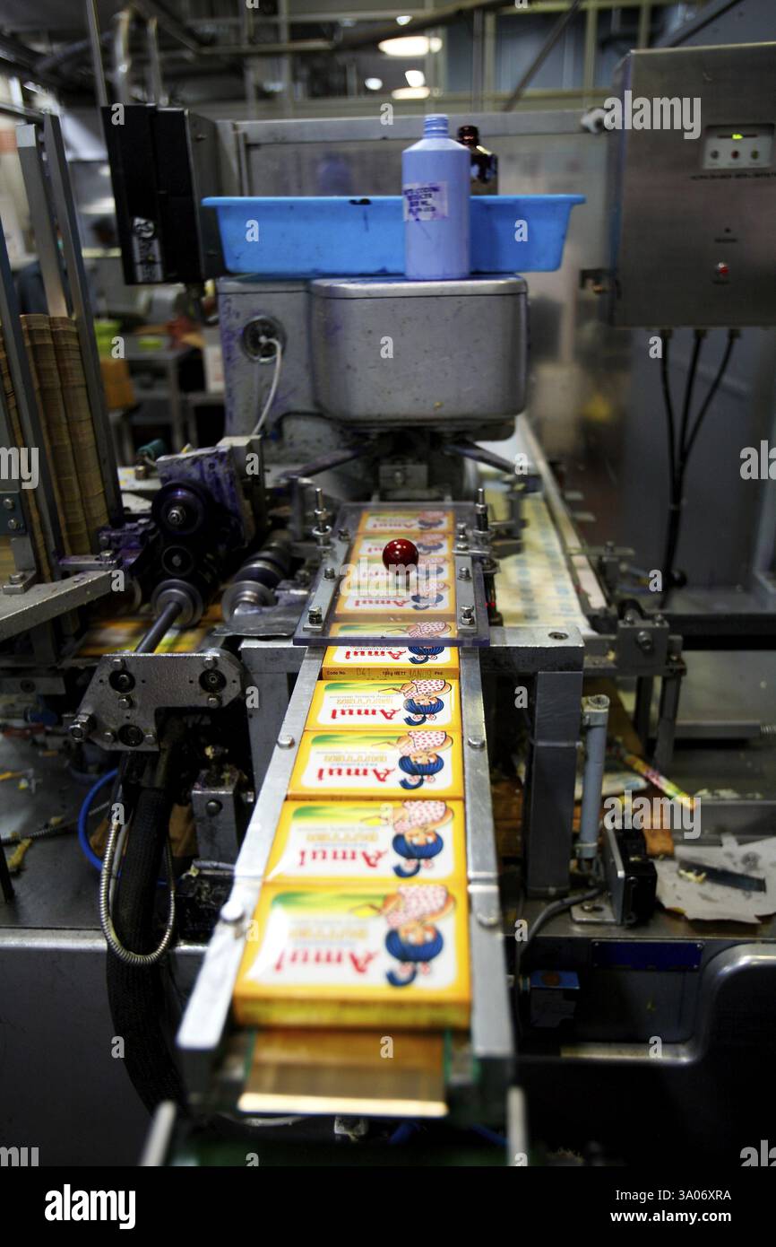 Packed Amul butter in wrappers coming out in Amul factory in Anand ...
