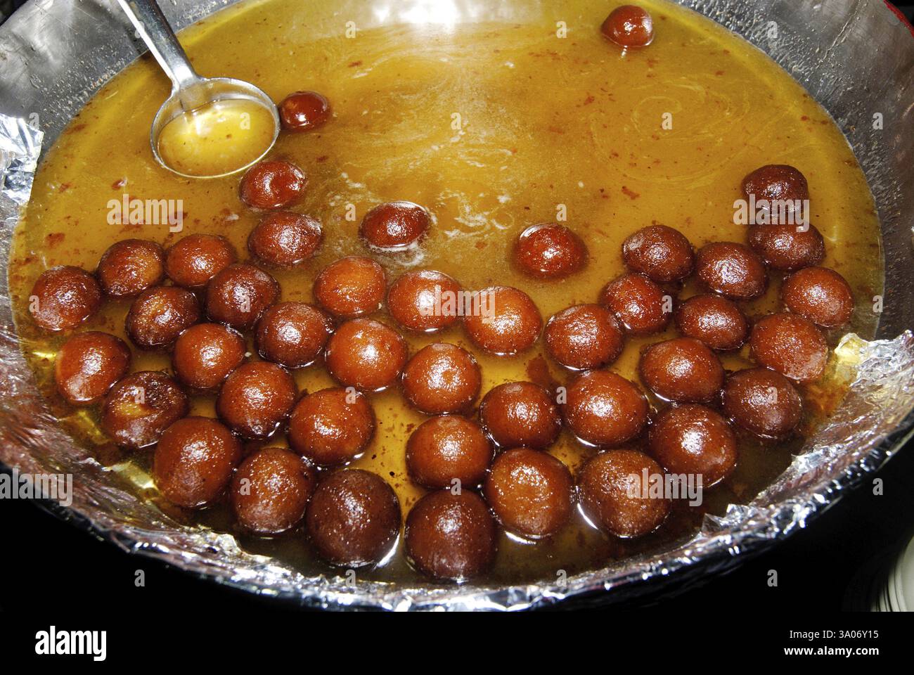 Gulab Jamun, Indian sweet, chocolate colour balls made by mava deep in ...