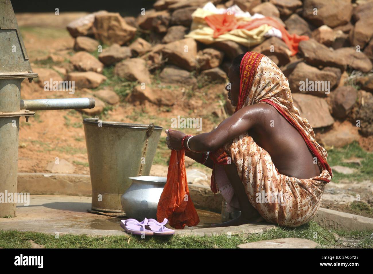 Lady washing clothes at community hand pump in Jharkhand, India, Asia Stock Photo - Alamy