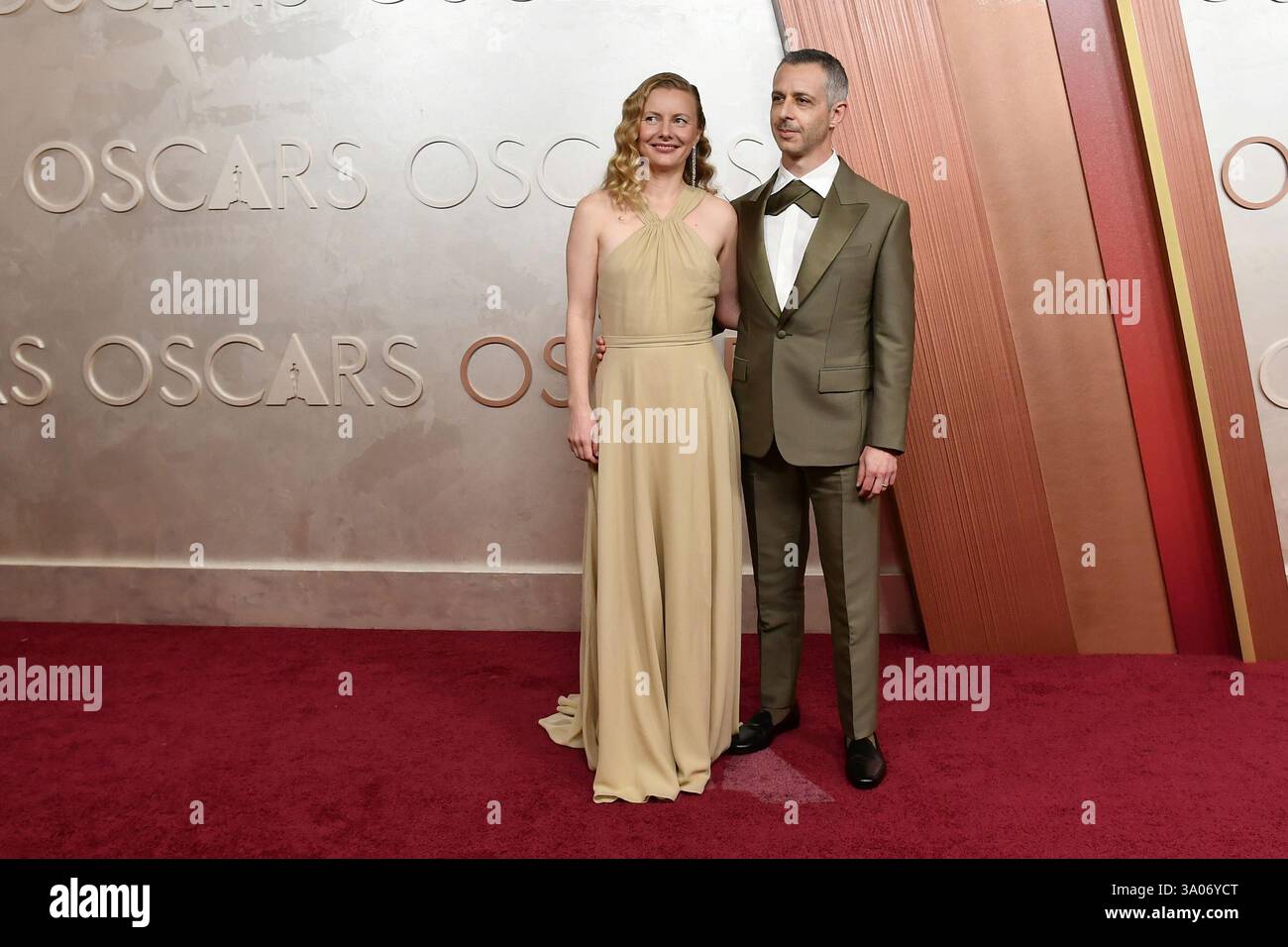 Emma Wall, left, and Jeremy Strong arrive at the Oscars on Sunday ...