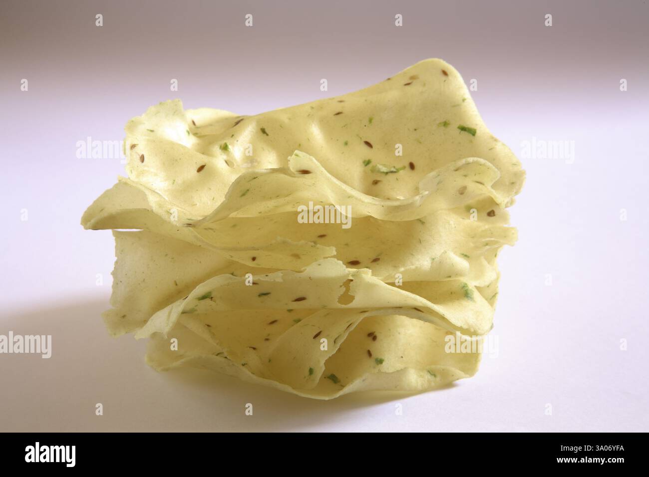 Deep fry papad poppadom made of lentil or cereal flours on white ...