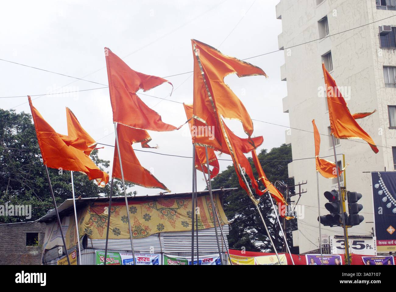 Scarlet colour flags of Hindu religion waving in air, Ganapati festival ...