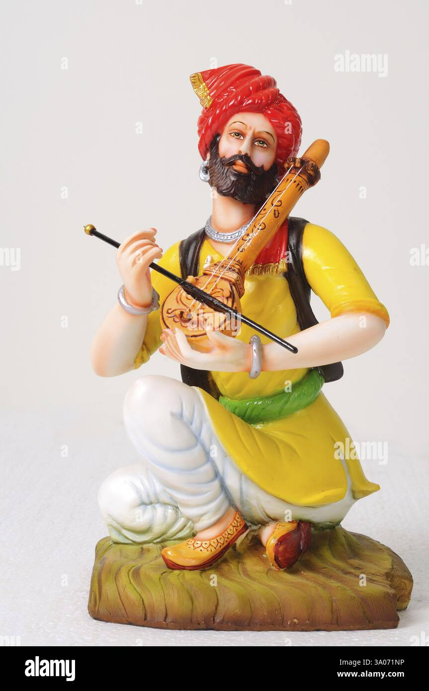 Clay figurine, statue of rajasthani musician playing sarangi Stock ...