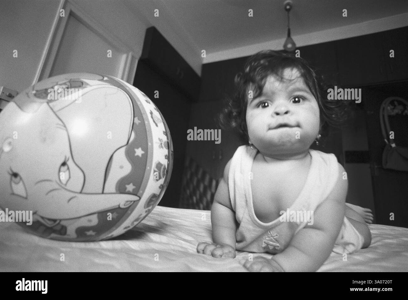 Baby infant girl crawling with toys Model release number 477 Stock ...