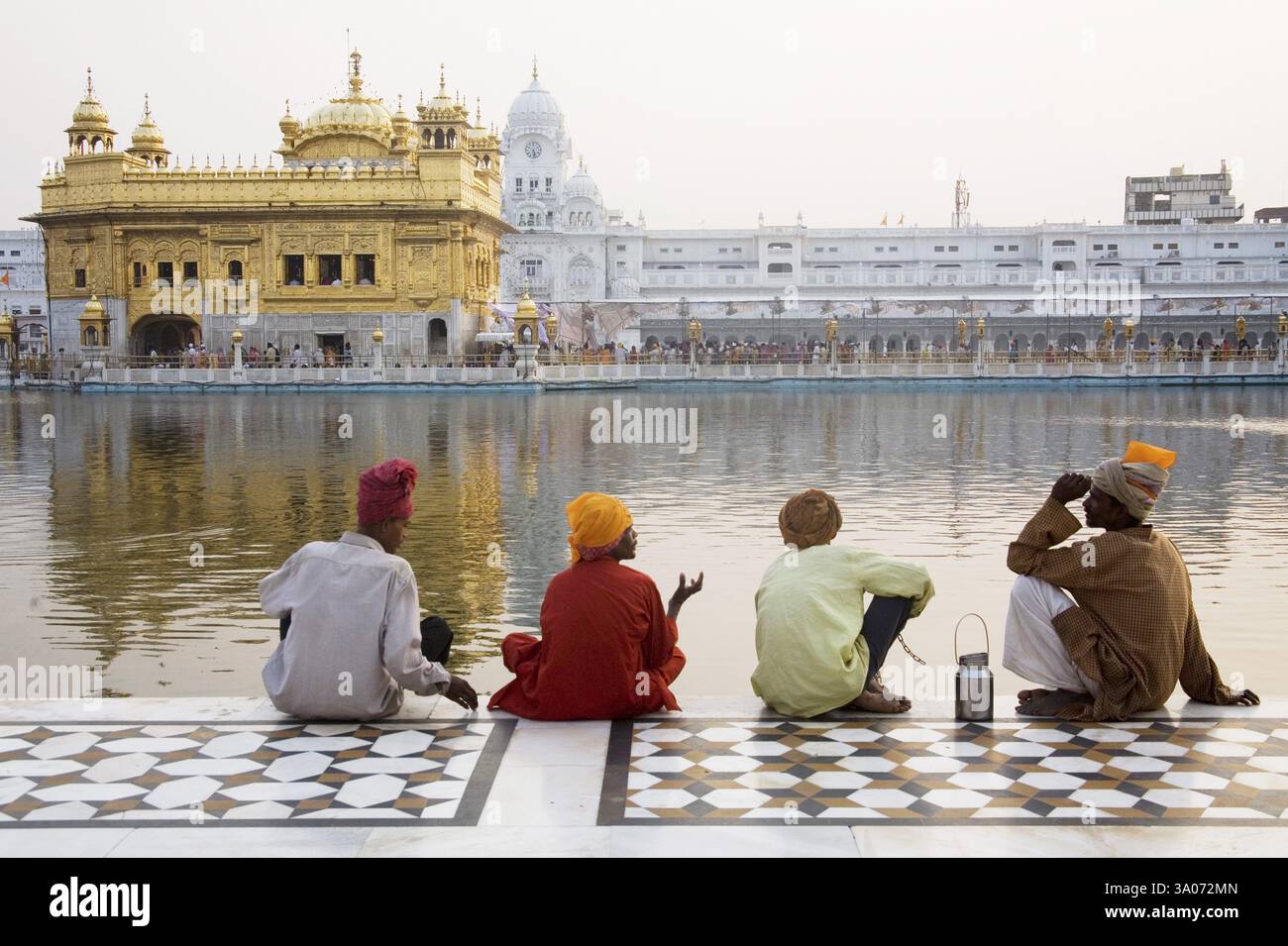 Sikh Devotees sitting evening holy water of the pool near, Hari Mandir ...