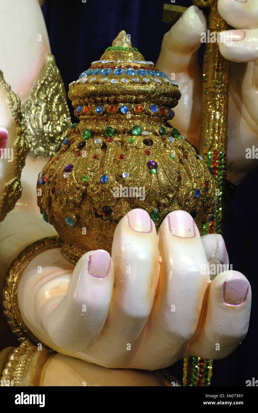 Hand of Lord Ganesh with Modak of Gold encrusted with gems, Ganapati ...