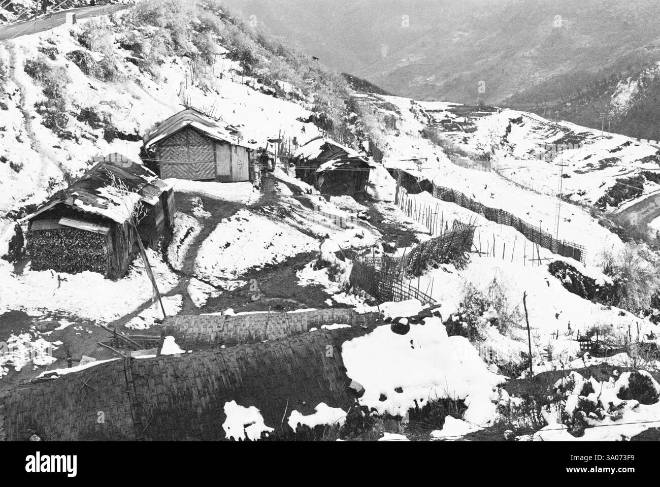 Village shrouded in snow during winter, Arunachal Pradesh, India 1982 ...