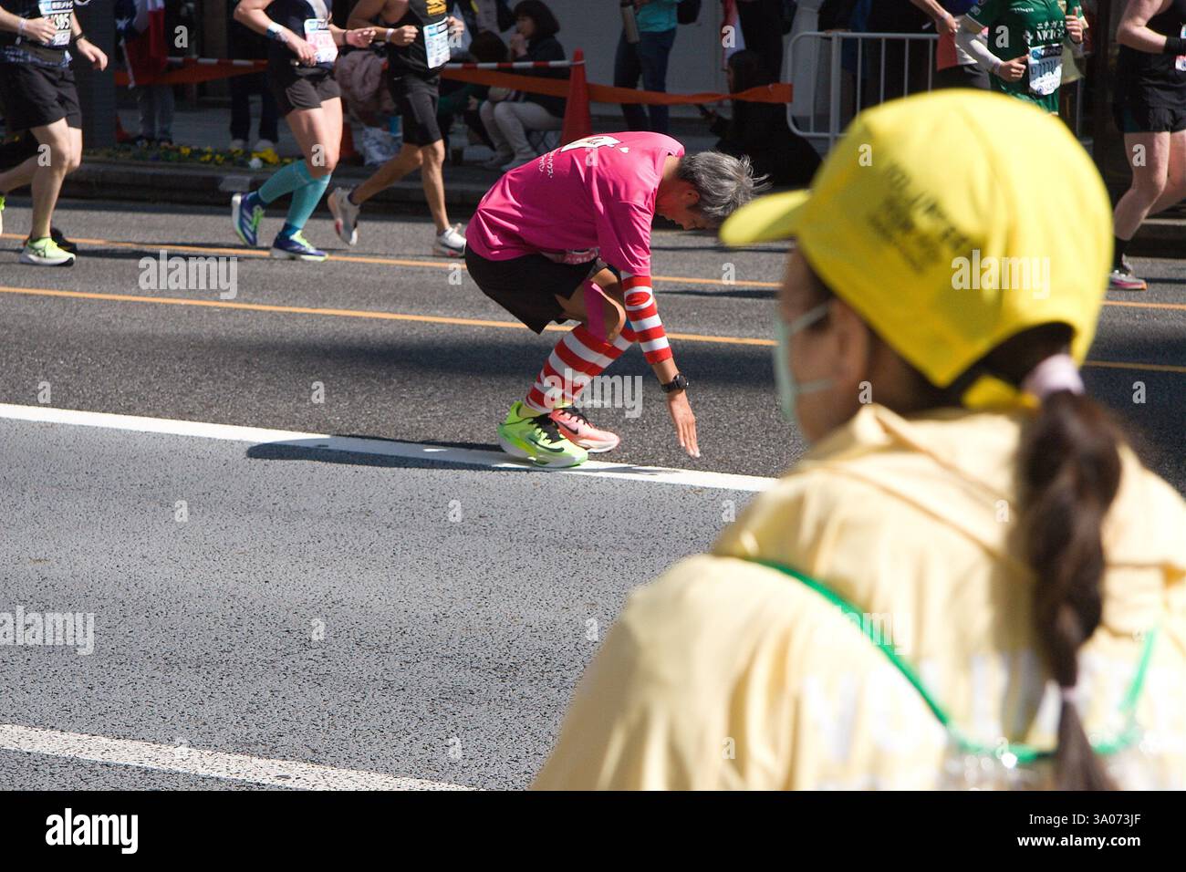 A runner struggles at Tokyo Marathon 2025 with 38.000 Runners and ...