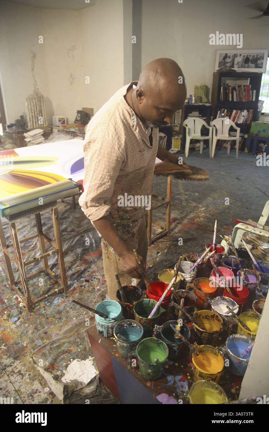 Indian contemporary artist Bose Krishnamachari in his studio working on ...