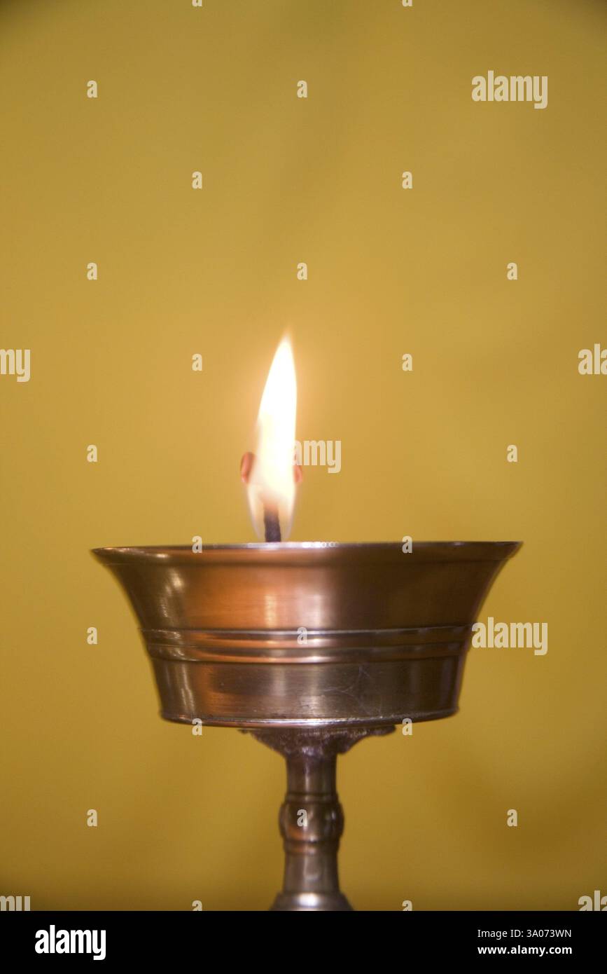Butter lamp flame fire in the meditation hall of Tibetan temple ...